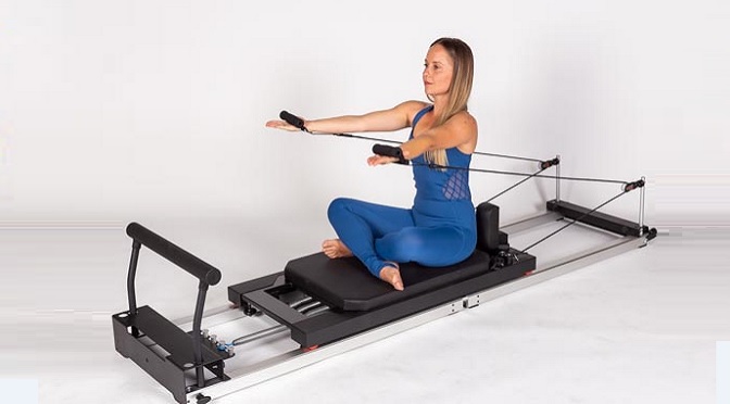 Pilates@home using a home reformer: queen arms - AthensTrainers®